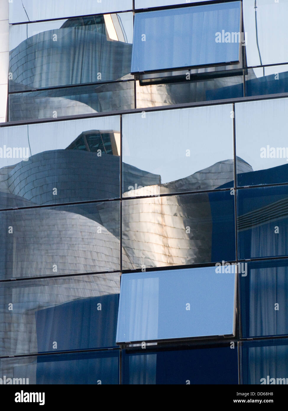 GUGGENHEIM MUSEUM OF MODERN ART (©FRANK GEHRY 1997) REFLECTED IN GLASS ...