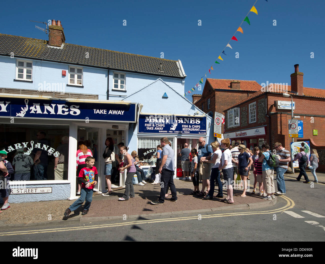 Cromer Fish and Chip shop with queues of summer visitors Stock Photo ...