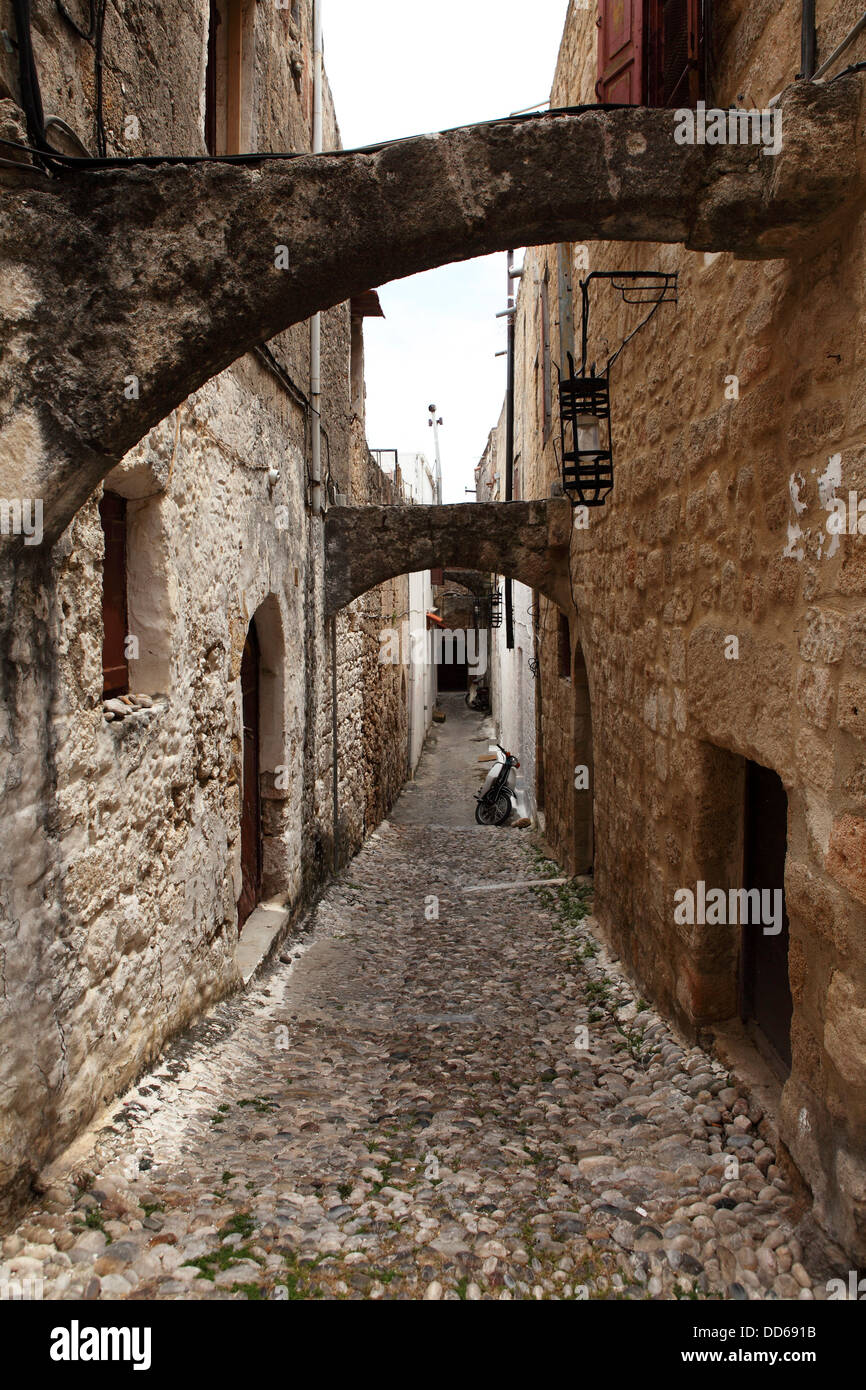 Buttressed houses and a cobbled lane in Rhodes City, Rhodes, Greece ...