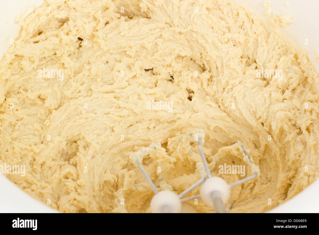 Finishing cake dough in bowl Stock Photo - Alamy