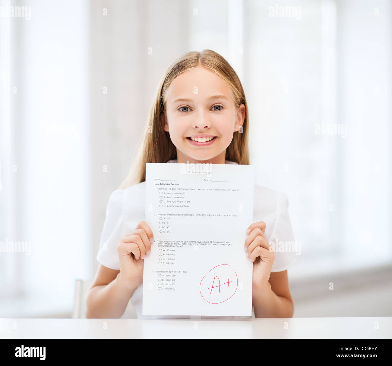 girl with test and grade at school Stock Photo - Alamy