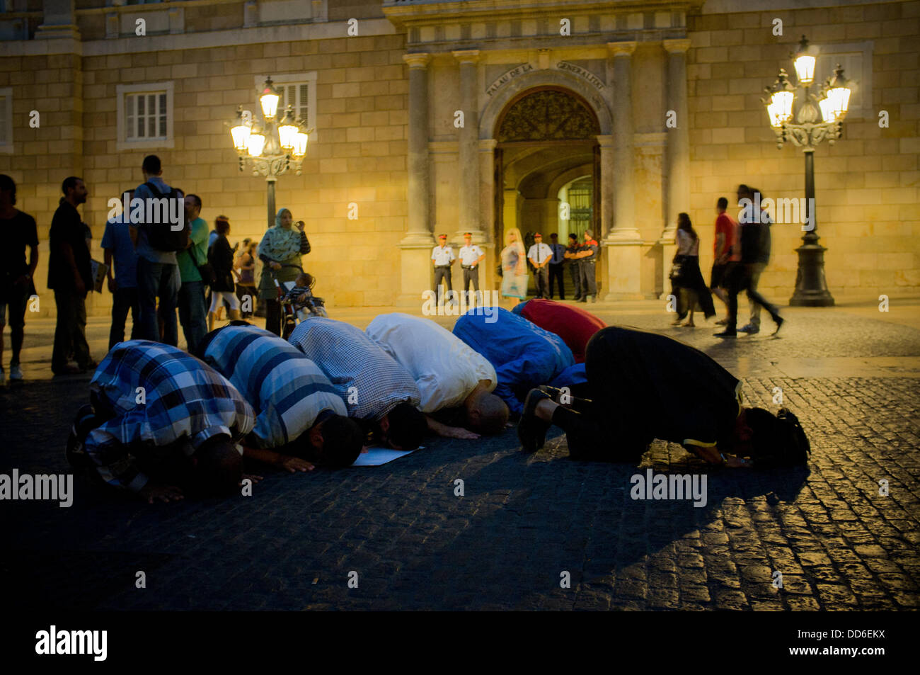 Muslims pray in street hi-res stock photography and images - Alamy