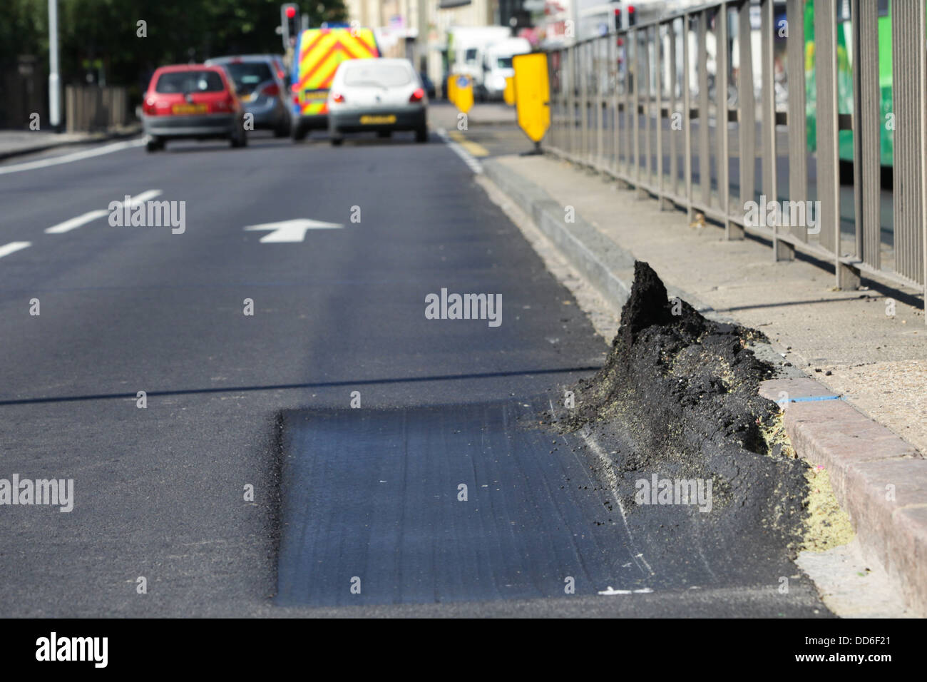 THE WAVE LIKE SHAPE OF THE MELTED TARMAC IN THE CITY CENTRE OF ...