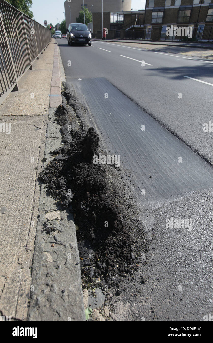 THE WAVE LIKE SHAPE OF THE MELTED TARMAC IN THE CITY CENTRE OF ...