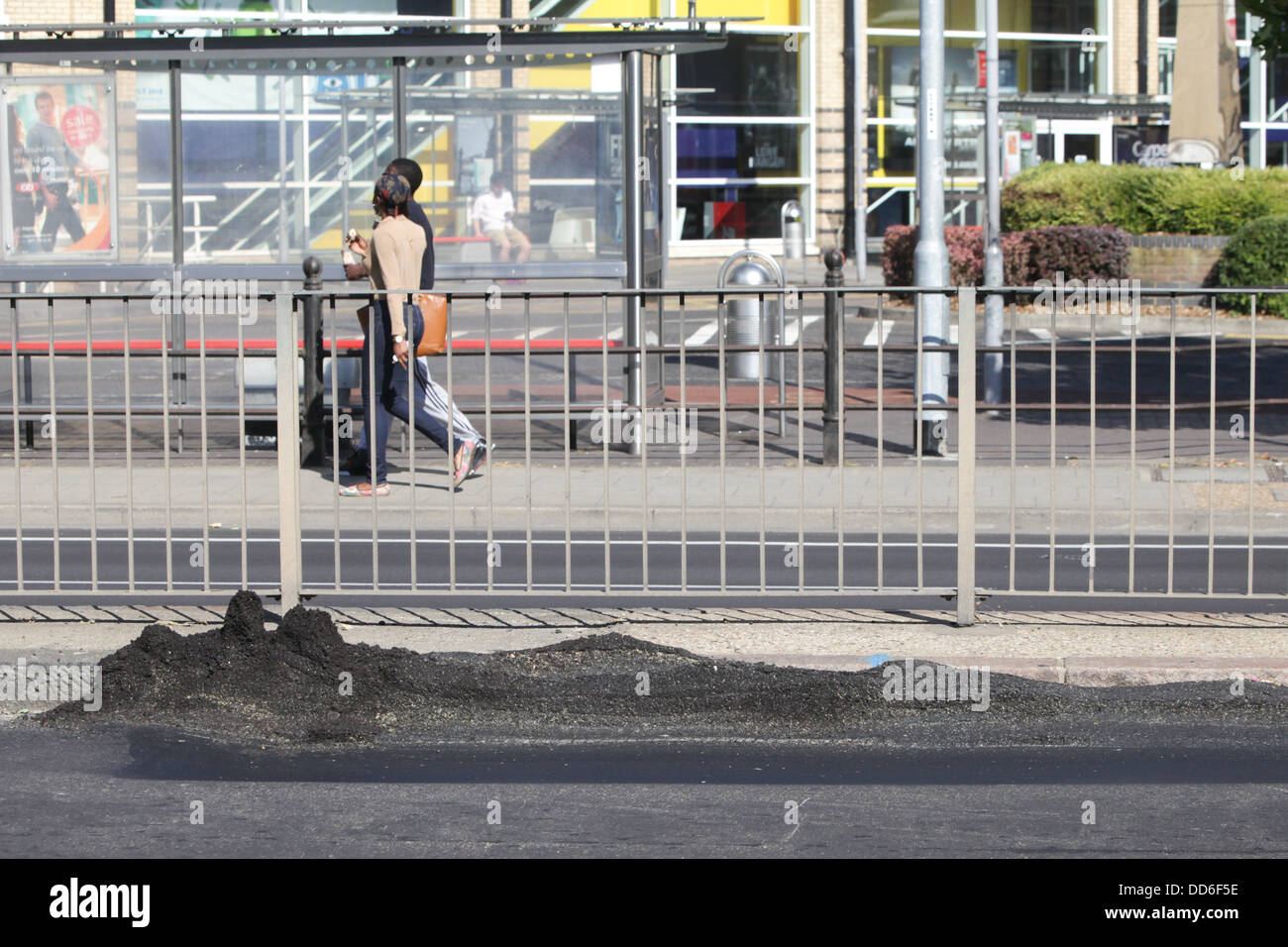 THE WAVE LIKE SHAPE OF THE MELTED TARMAC IN THE CITY CENTRE OF ...