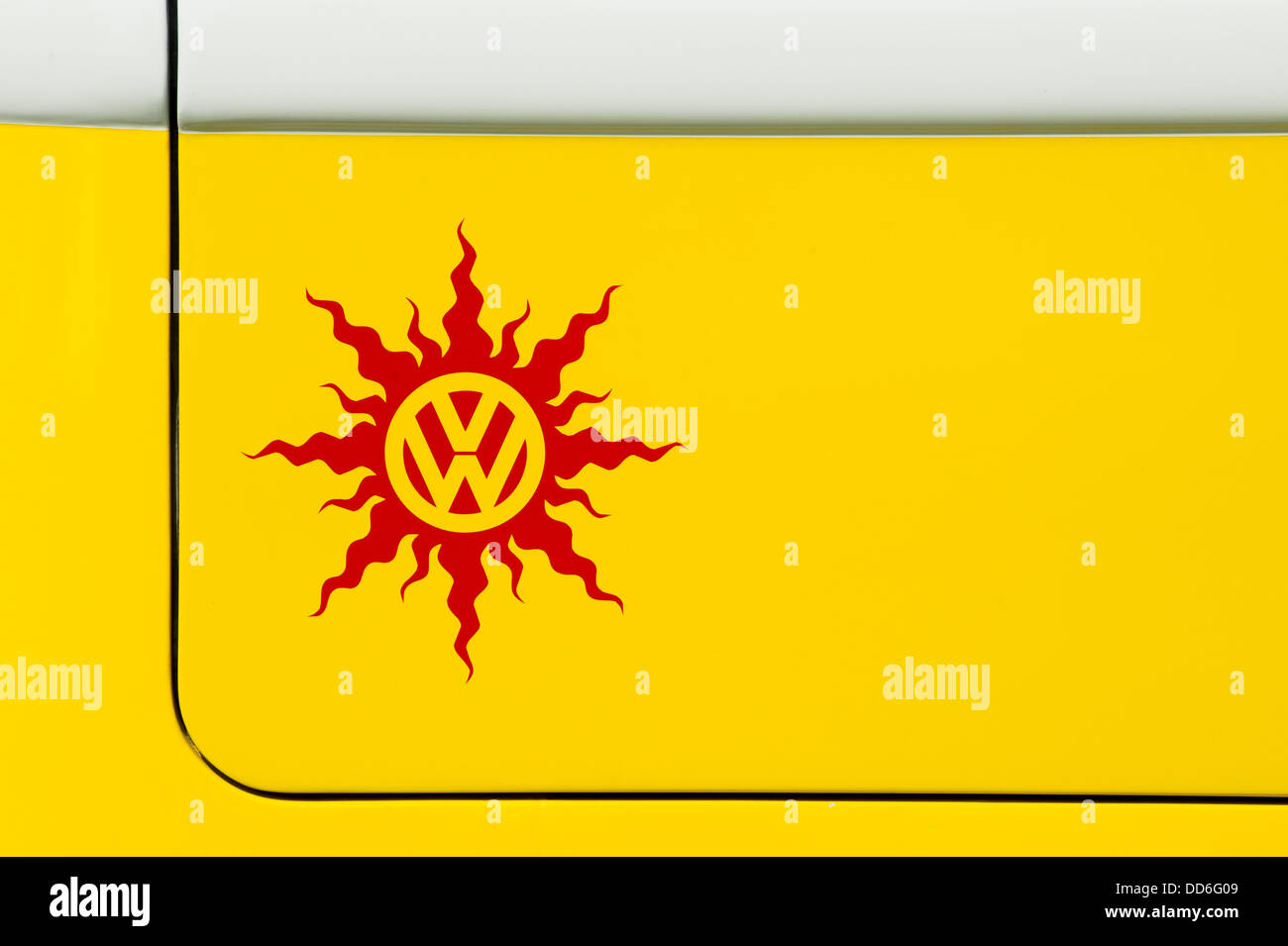 Yellow Volkswagen camper van rear end VW sun sticker Stock Photo - Alamy