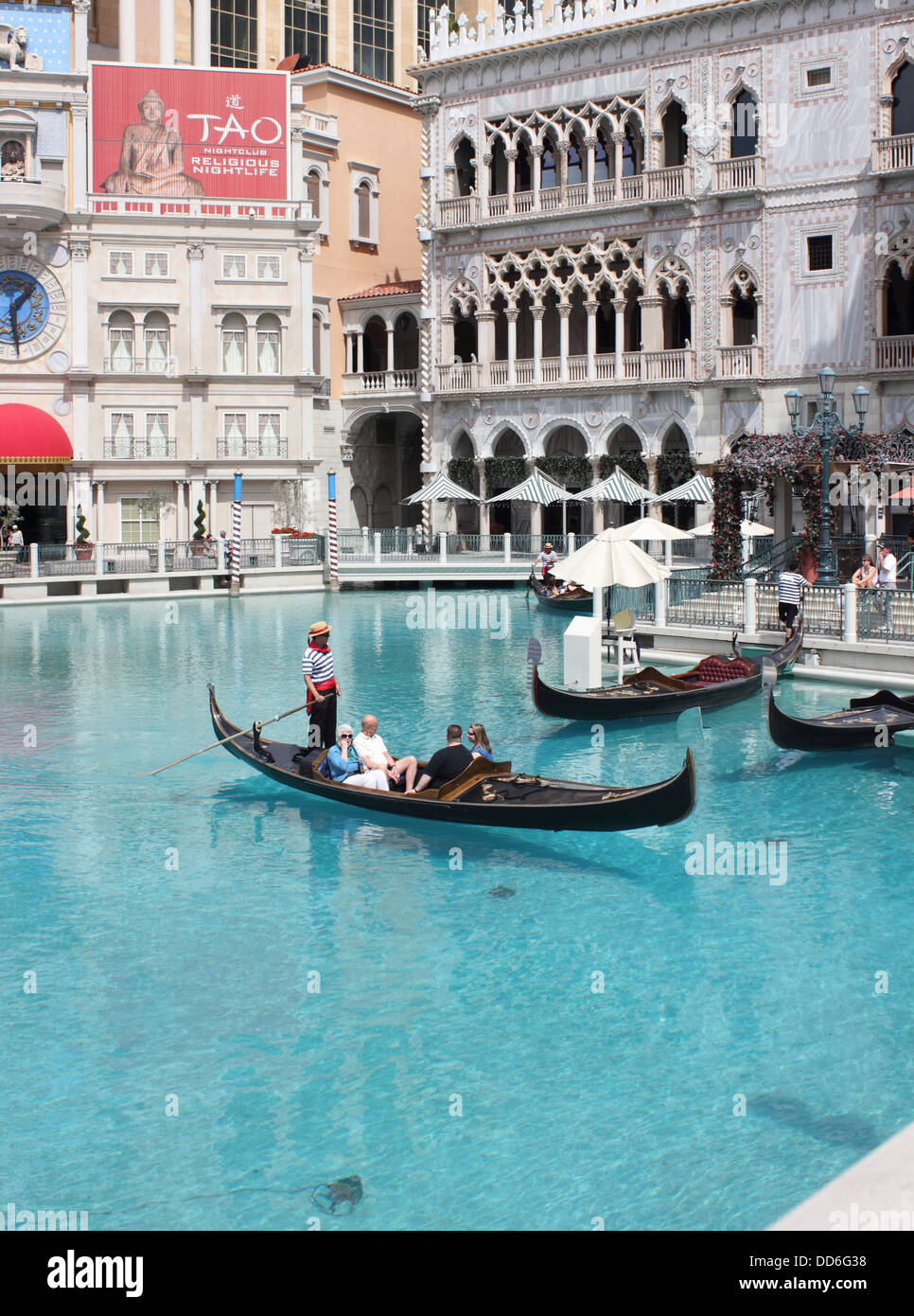 The Venetian hotel with Gondola and passengers Stock Photo - Alamy