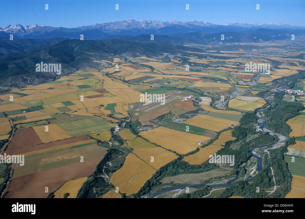 Aerial view of Rio Aragon river and back Pyrenees mountains range near ...