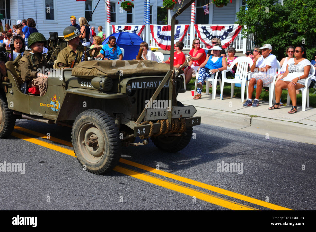 Soldier in military police jeep with Paris 97km sign on front, 4th of ...