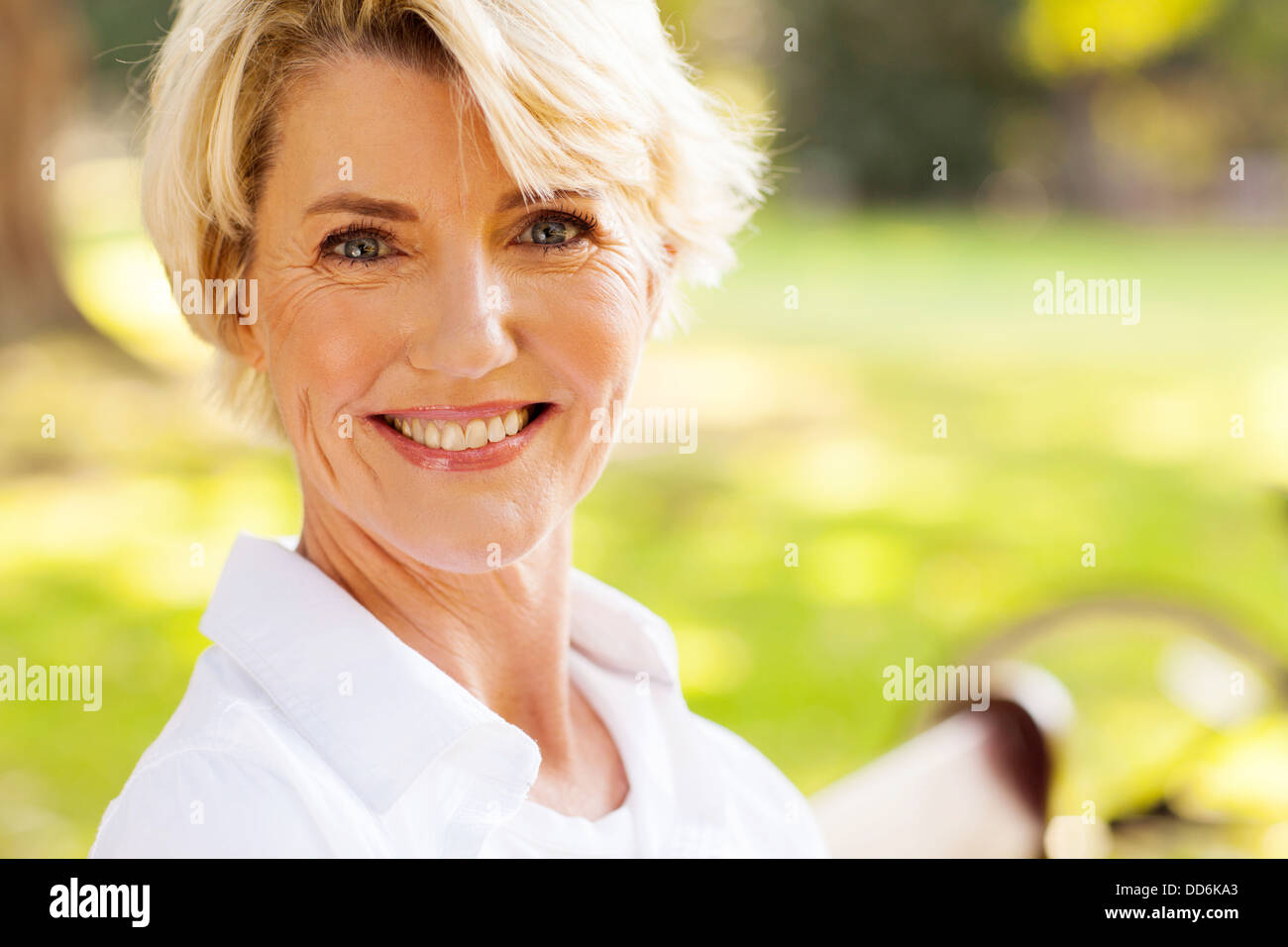 Portrait beautiful mature woman sitting hi-res stock photography and ...