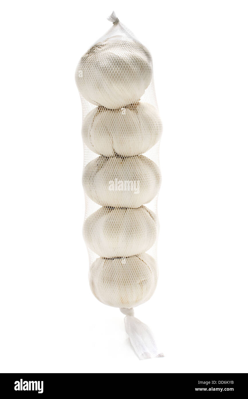 Net with garlic bulbs isolated on white Stock Photo - Alamy