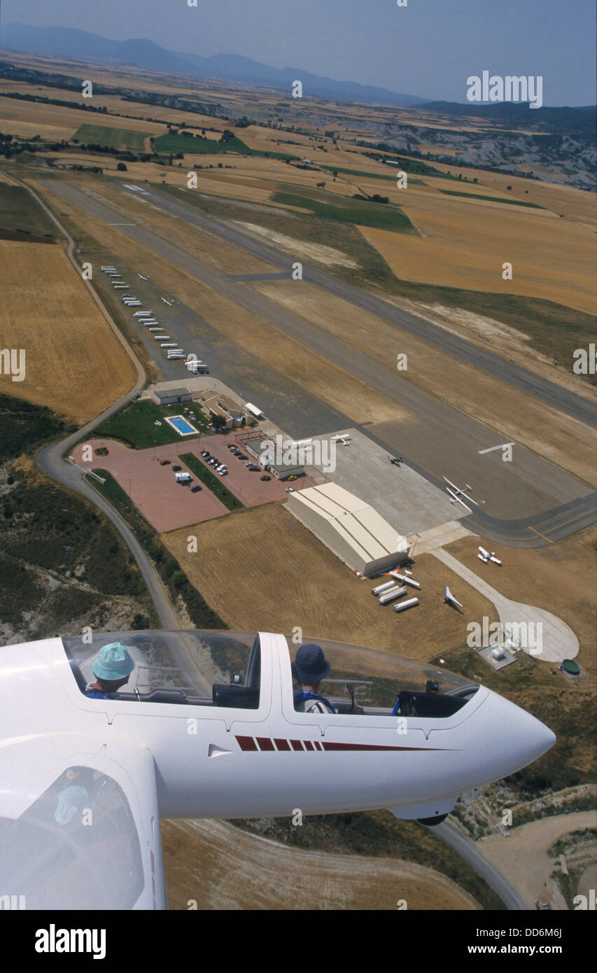 Aerial view of glider plane Twin Astir flying over aerodrome of Santa ...