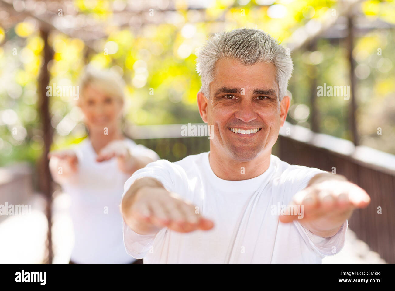 healthy middle aged man and woman workout outdoors Stock Photo - Alamy