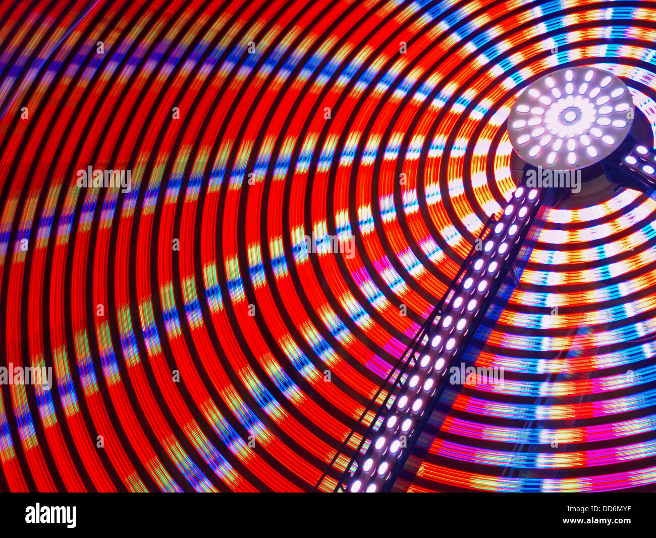 The blurred lights of a spinning carnival ride Stock Photo - Alamy