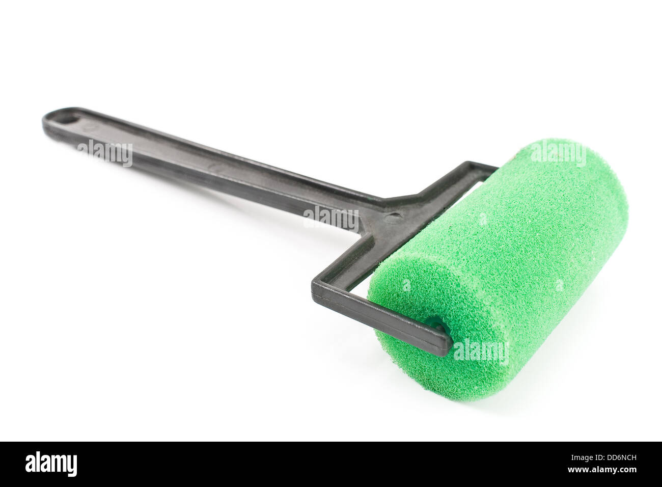 Small green paint roller isolated on white Stock Photo - Alamy