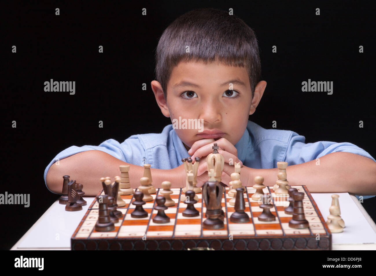 Unsure of next chess move Stock Photo - Alamy
