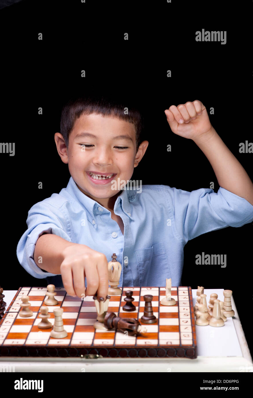 Boy celebrates chess win Stock Photo - Alamy