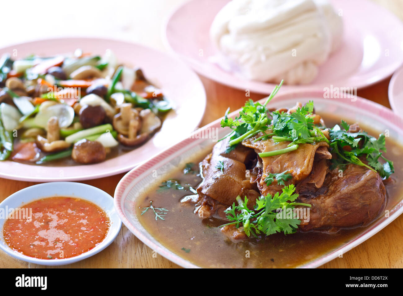 Pork leg stew in plate eat with mantou Stock Photo - Alamy