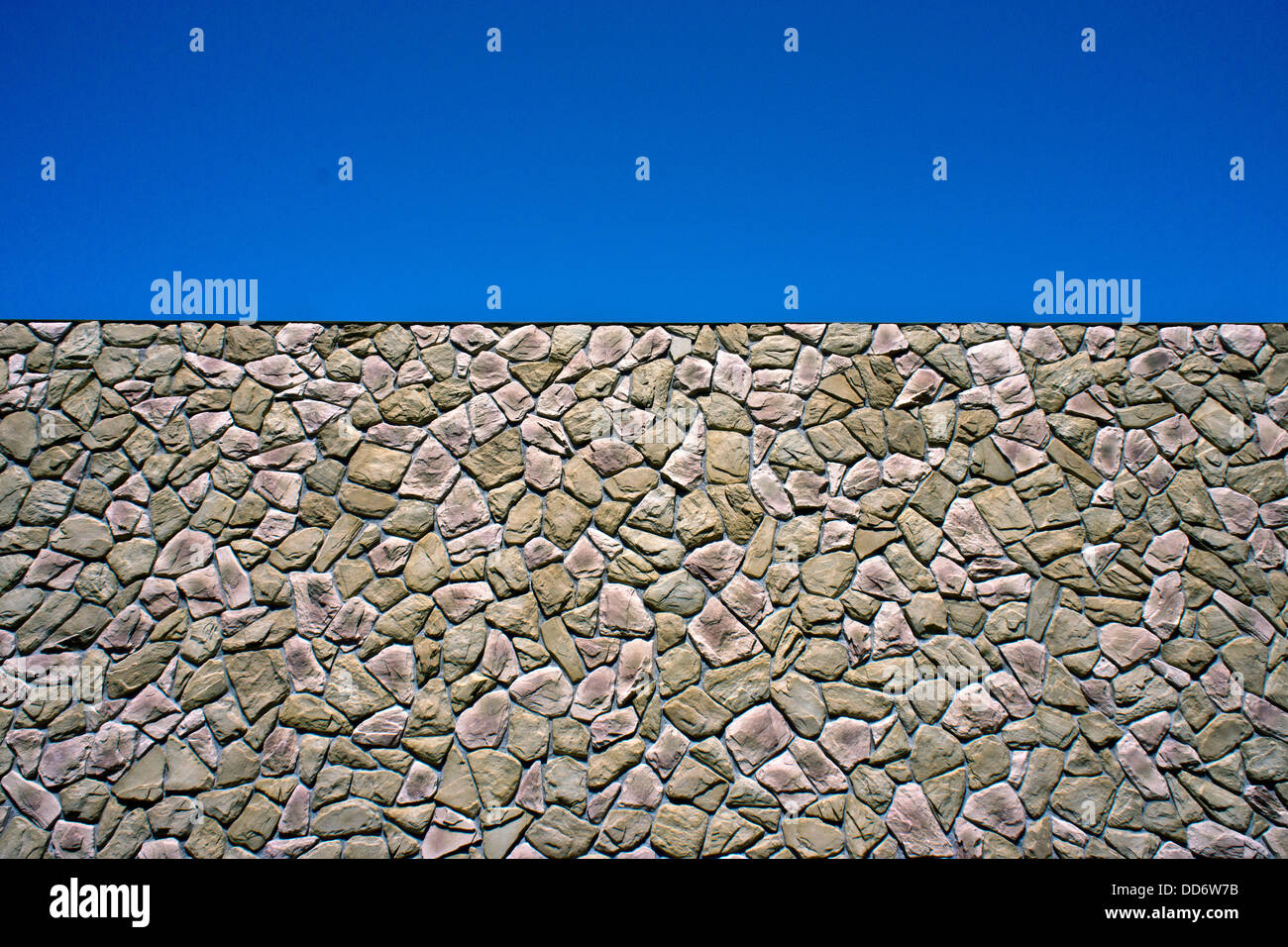 Stone wall and blue sky Stock Photo - Alamy