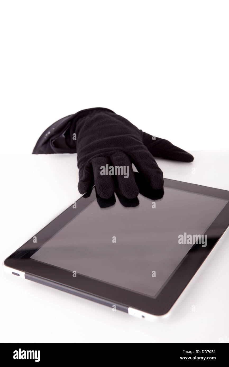 A thief stealing a tablet computer - piracy concept Stock Photo - Alamy