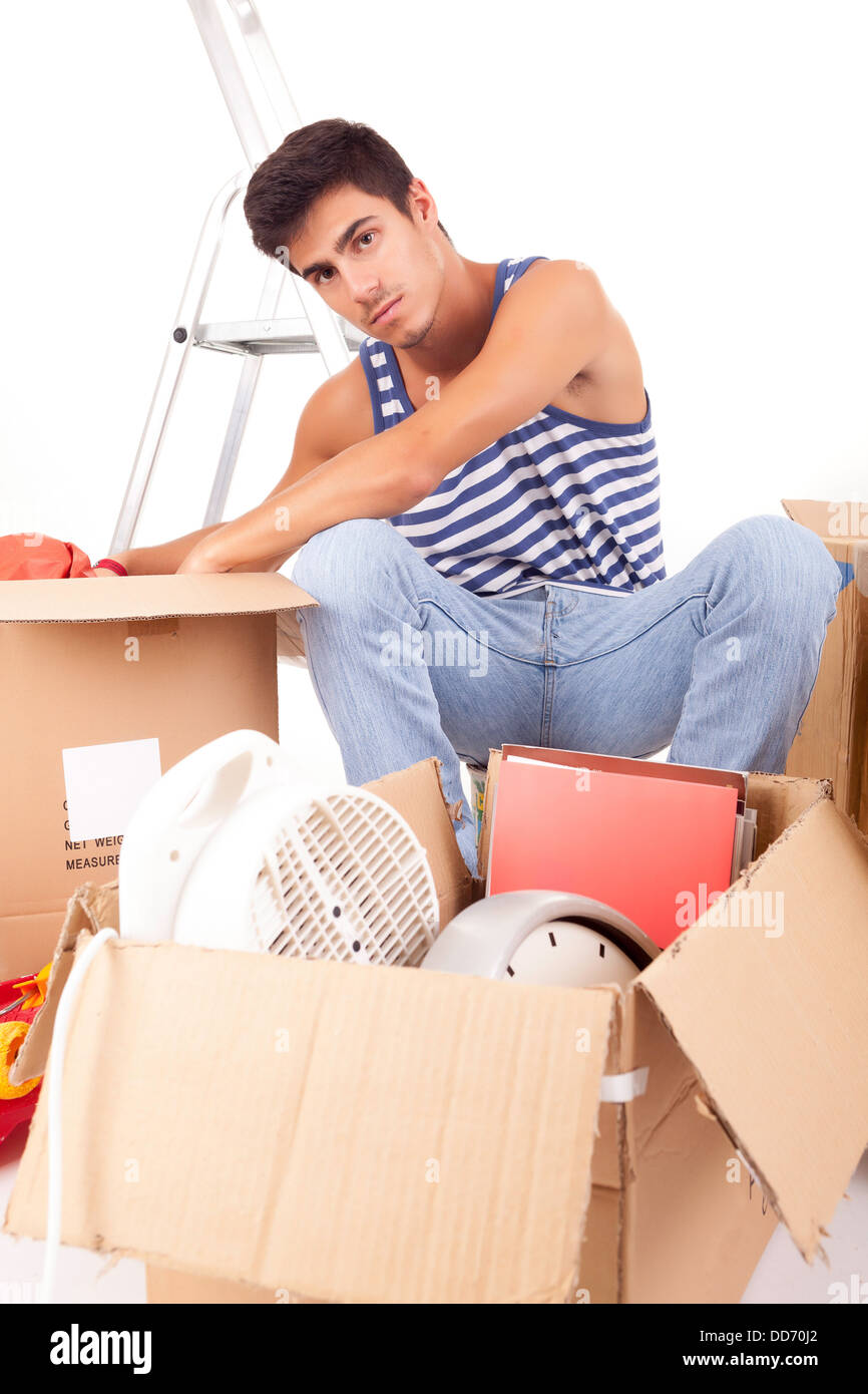 Young man moving to new house, isolated over white Stock Photo - Alamy