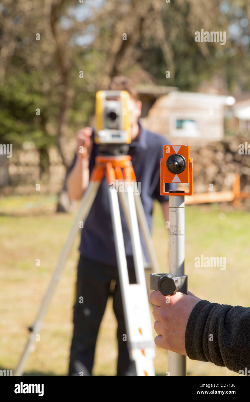 Germany, Brandenburg, Man looking through theodolite Stock Photo - Alamy
