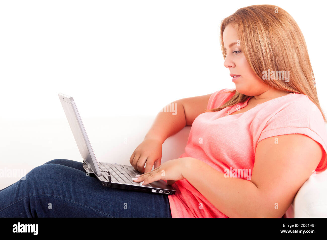 Young overweighted woman relaxing at home Stock Photo - Alamy