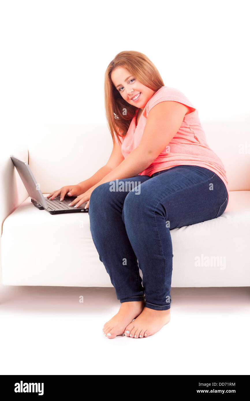 Young overweighted woman relaxing at home Stock Photo - Alamy