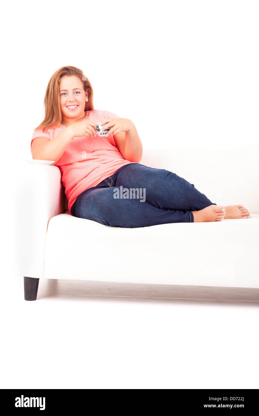 Young overweighted woman relaxing at home Stock Photo - Alamy