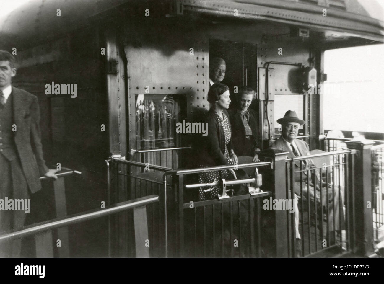 FDR and party aboard the rear platform of the President's special train ...