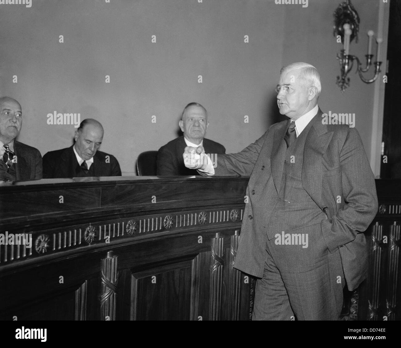 Jesse Jones defends the RFC policies to a House committee. Dec. 1, 1937 ...