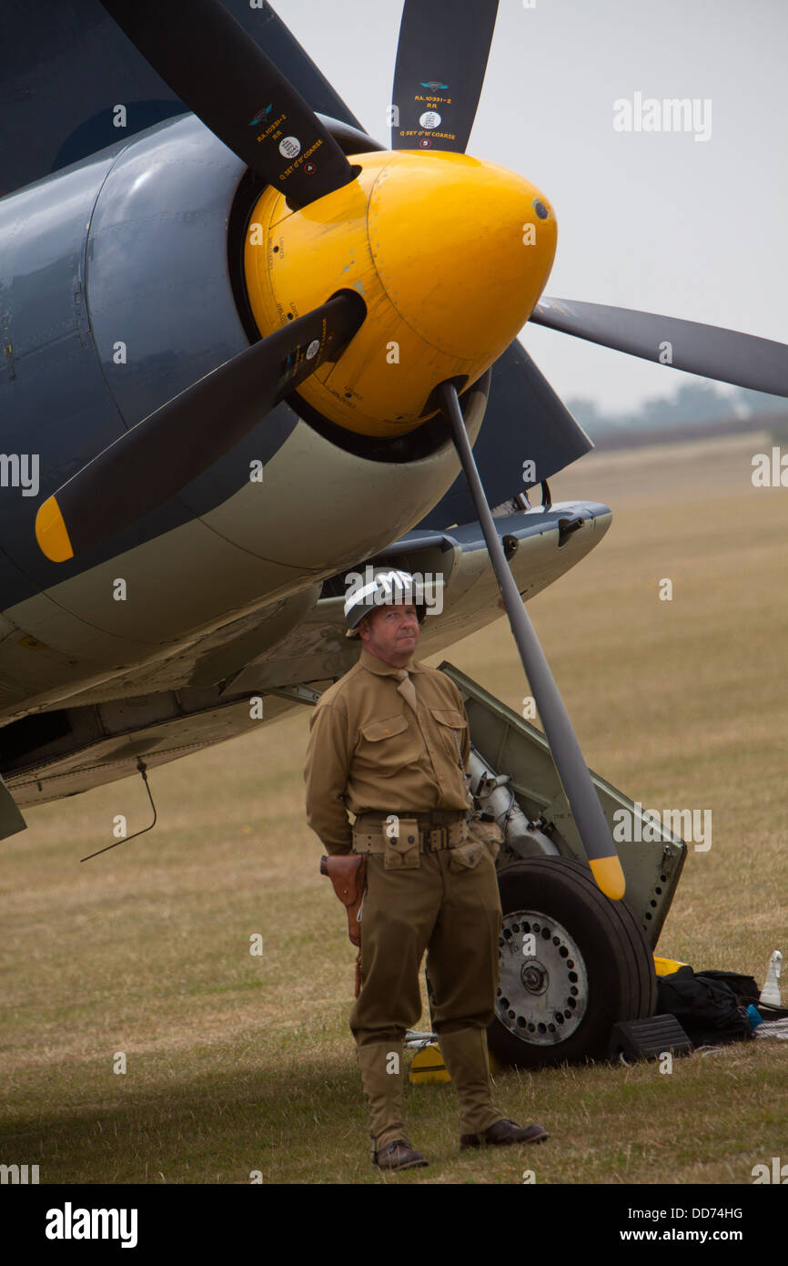 Aviation enthusiasts pose by WW11 aircraft at Duxford Classic Wings Air ...