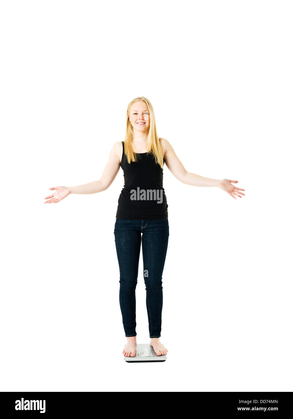 Girl on weight scale Stock Photo - Alamy