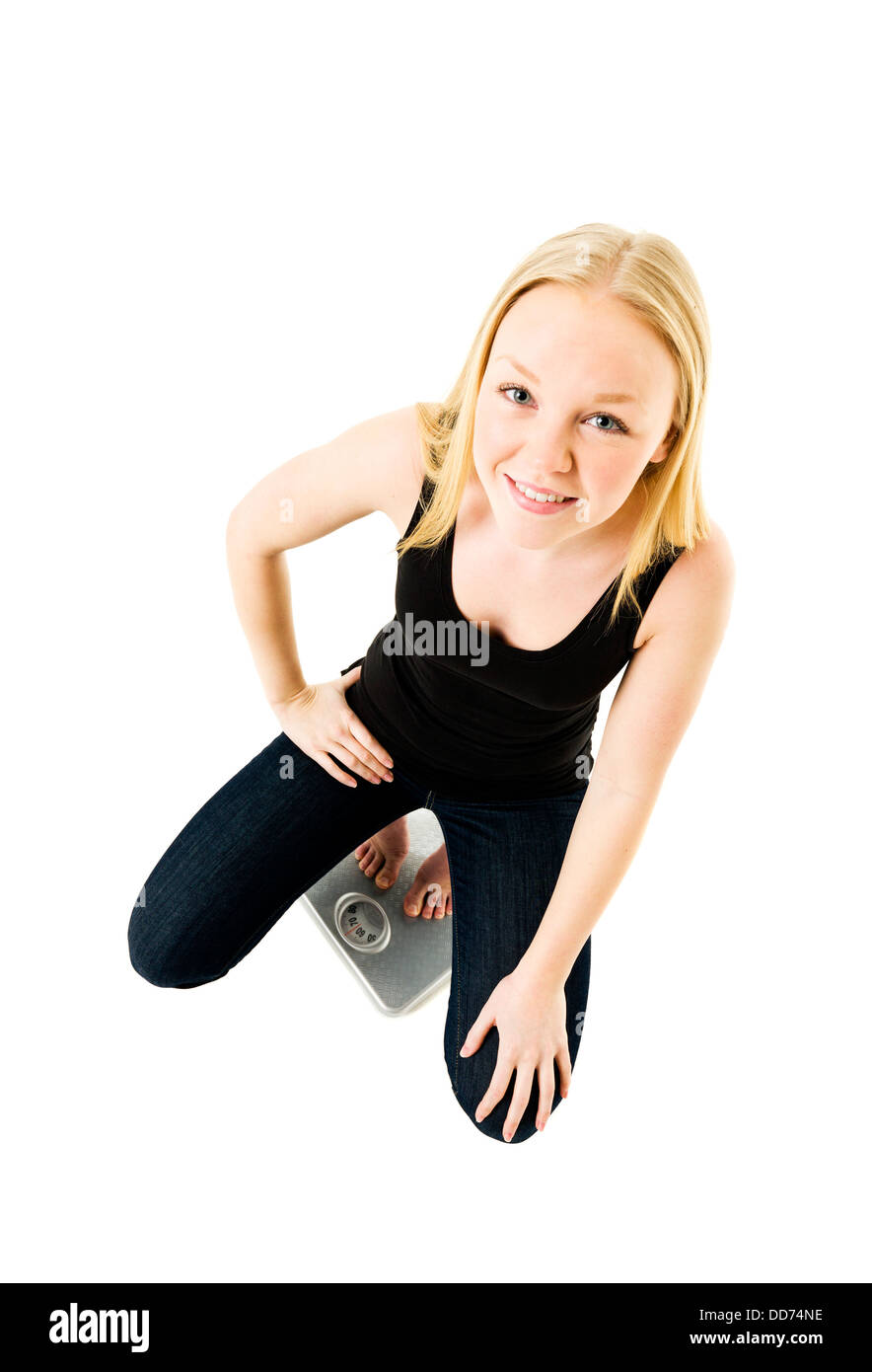 Girl on weight scale Stock Photo - Alamy
