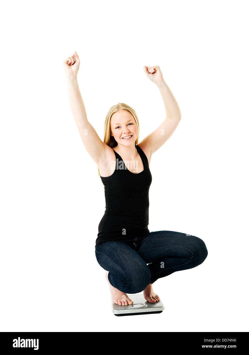 Girl on weight scale Stock Photo - Alamy