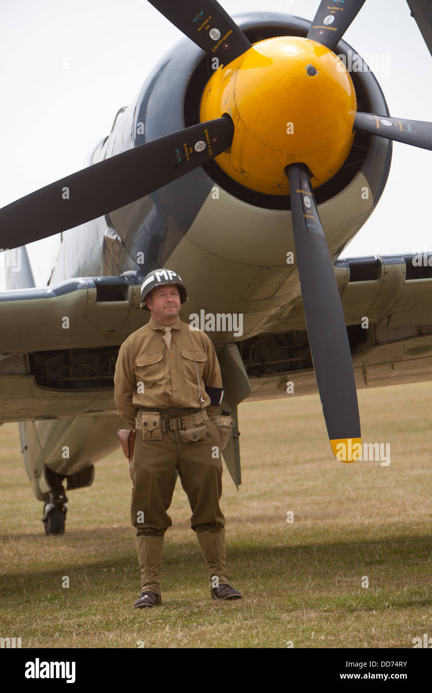 Aviation enthusiasts pose by WW11 aircraft at Duxford Classic Wings Air ...
