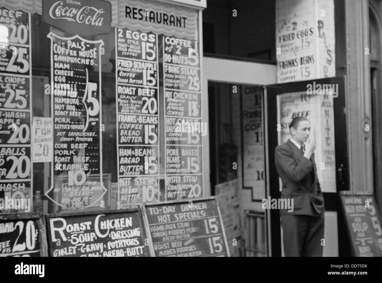 Depression era city restaurant with posted menu and prices. 15 cents in ...