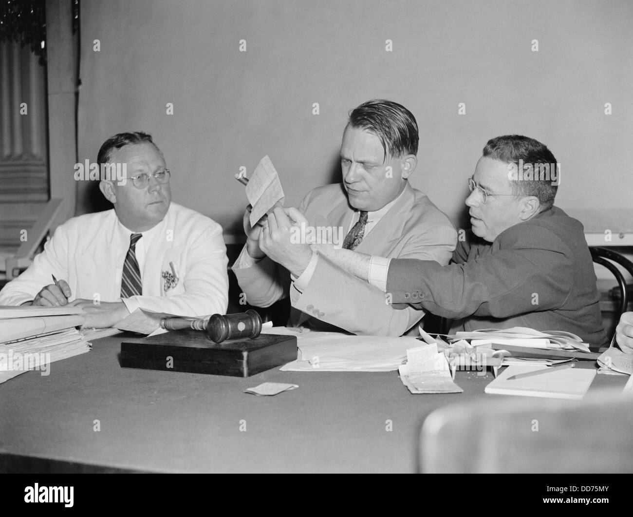 HUAC Chairman Martin Dies (center) views communist evidence, Aug. 1938 ...