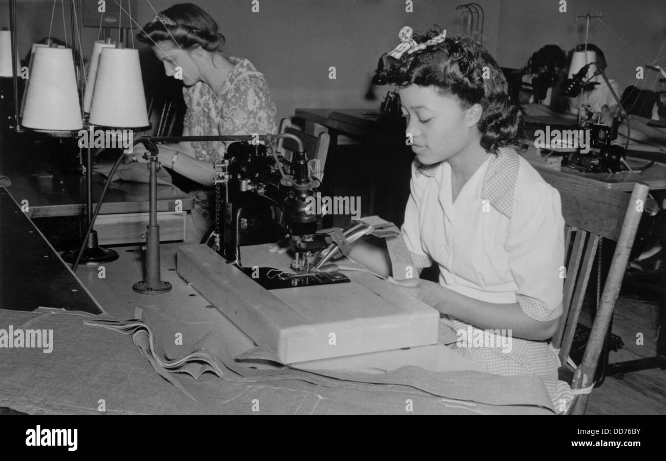 African American sewing a shirt in an integrated workroom, Waterloo ...
