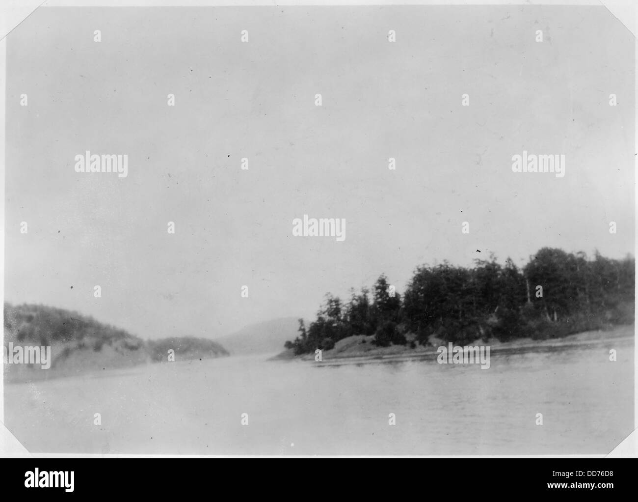 A simple photograph of a river, showcasing the natural flow of water ...