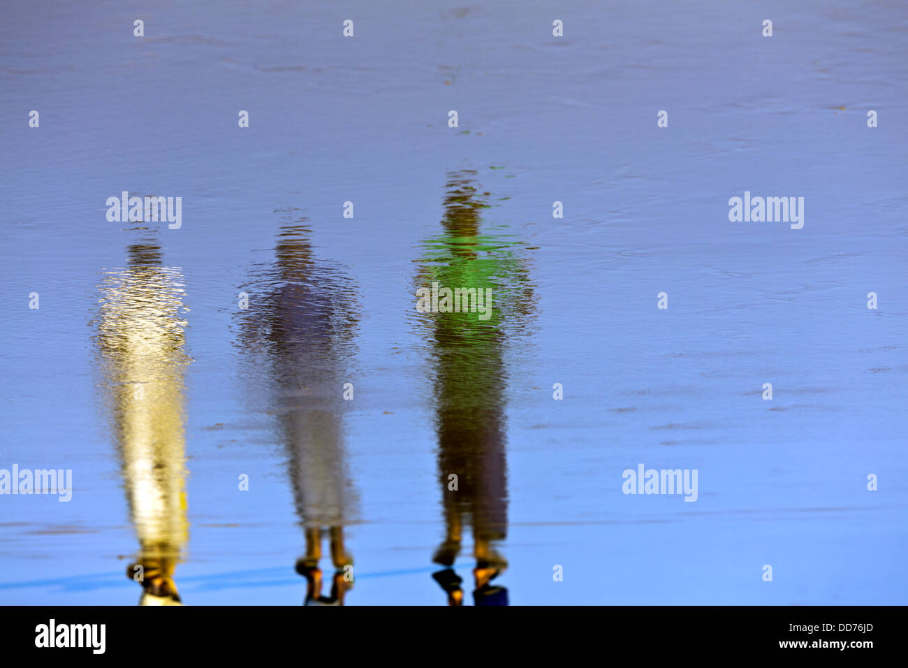 Mozambique, Nampula Province, men walking on shoreline Stock Photo - Alamy