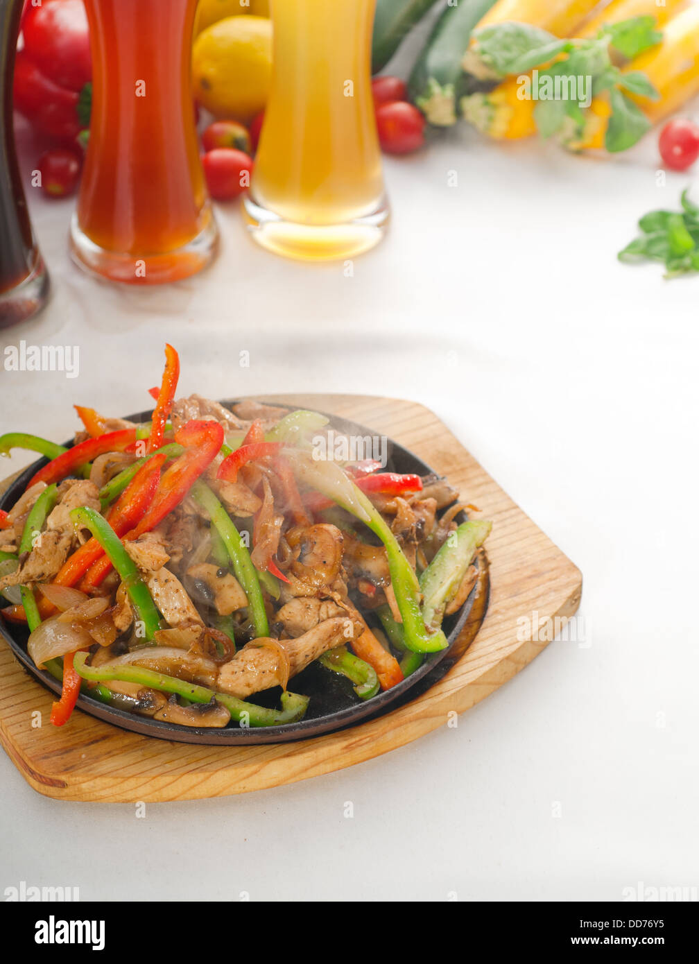 original fajita sizzling hot on iron plate Stock Photo - Alamy
