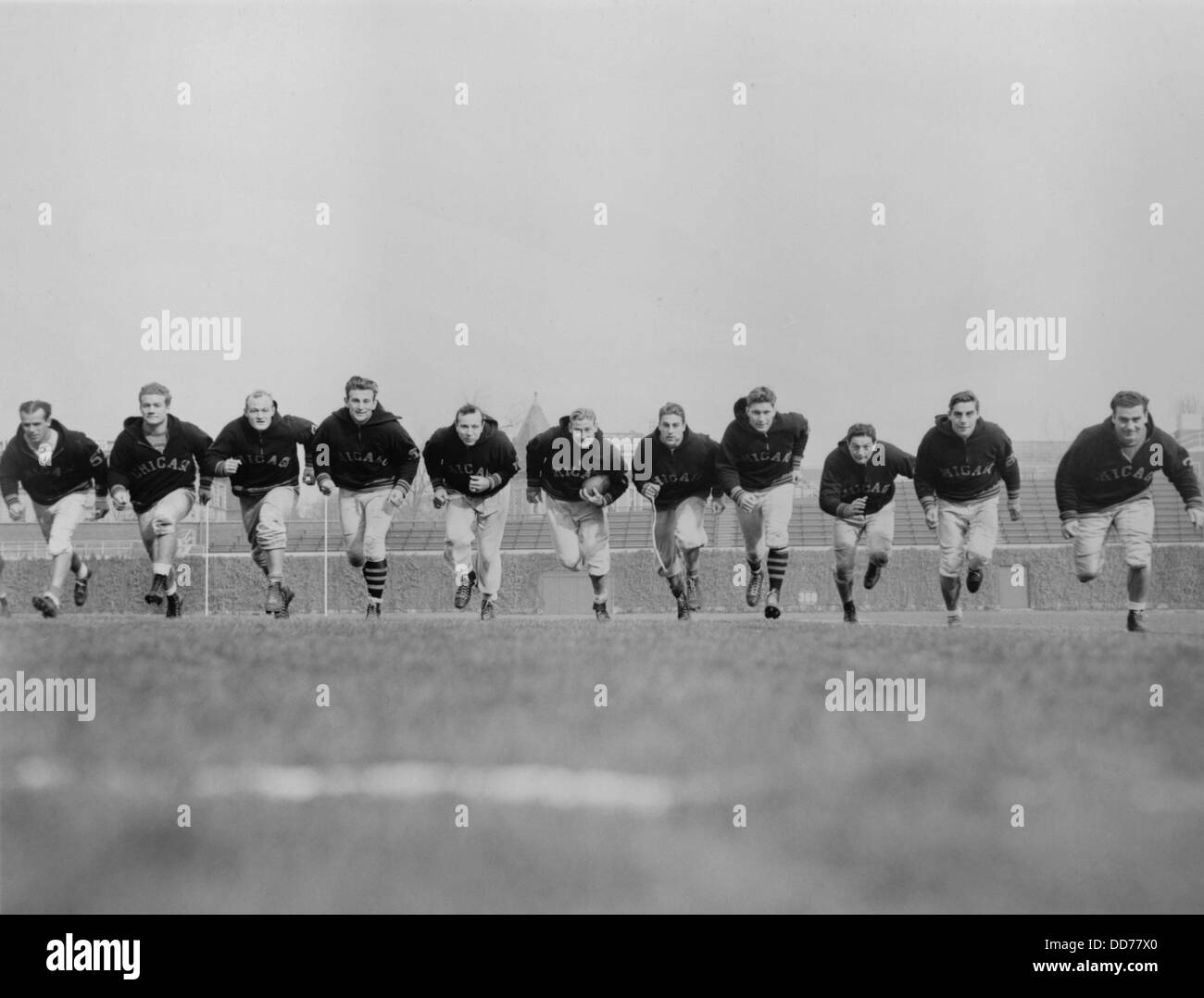 Chicago Bears' backfield charge downfield during practice session, 1941 ...