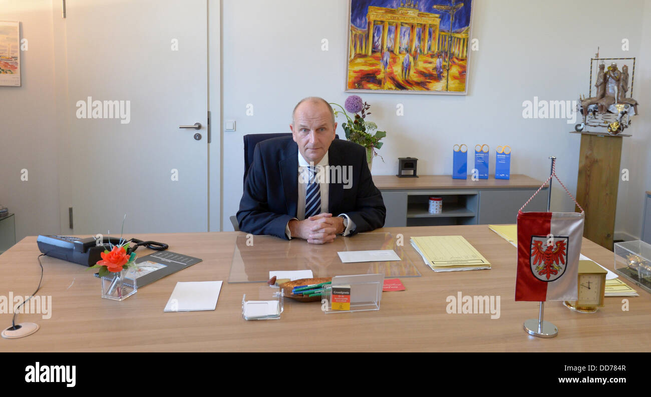 Brandenburg's newly elected premier Dietmar Woidke sits in his office ...