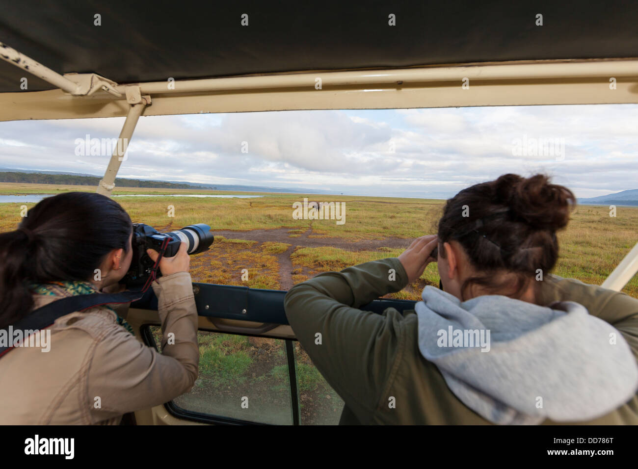 Africa,Kenya, Teenage girls taking picture at Lake Nakuru National Park ...