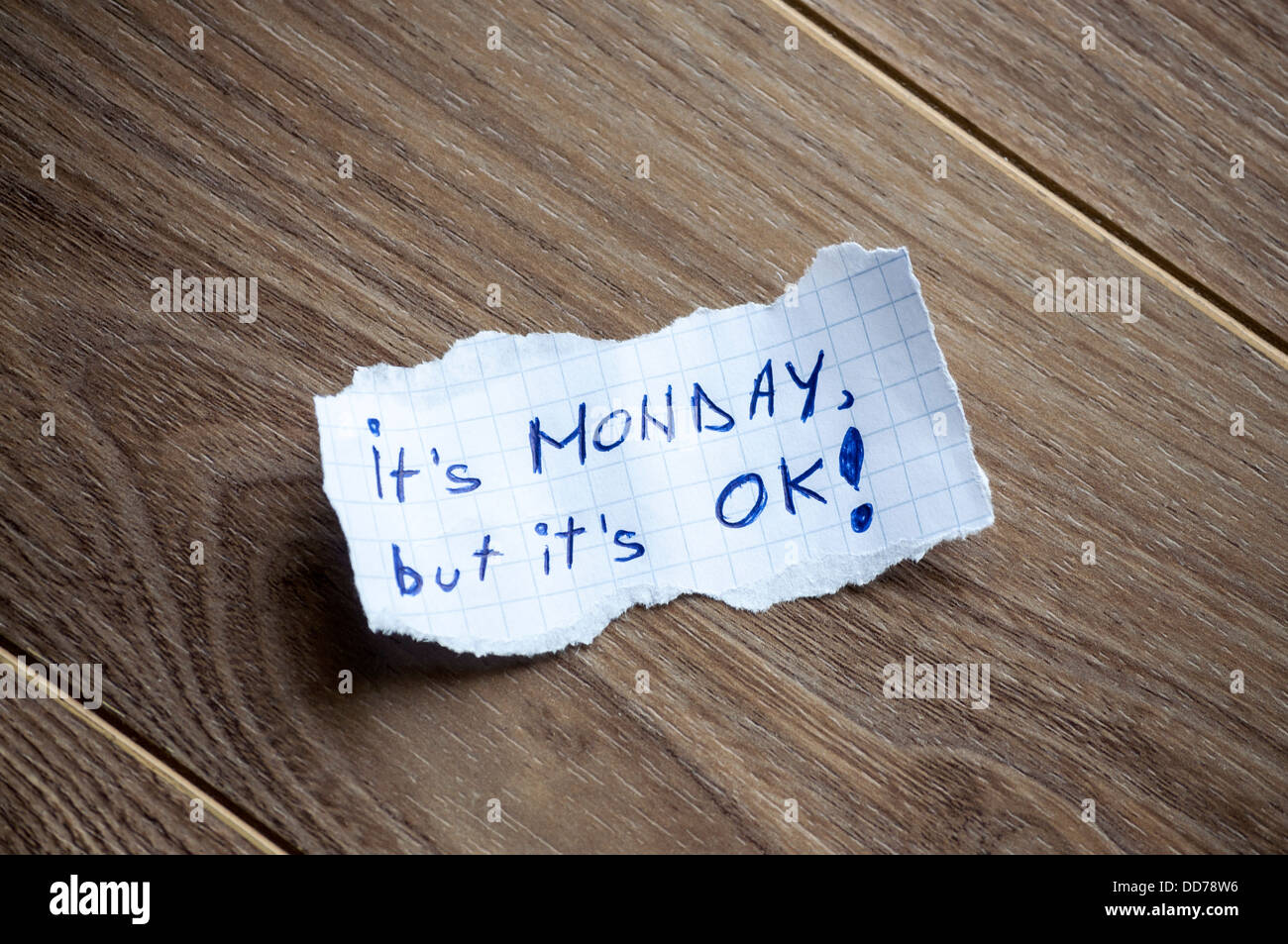 It's monday, but it's OK written on piece of paper, on a wood ...