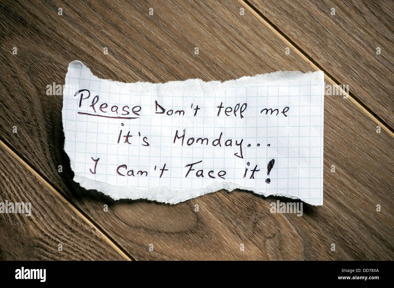 Monday message written on piece of paper, on a wood background Stock ...
