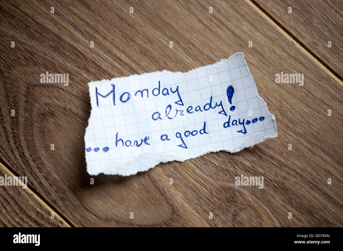 Monday already written on piece of paper, on a wood background Stock ...