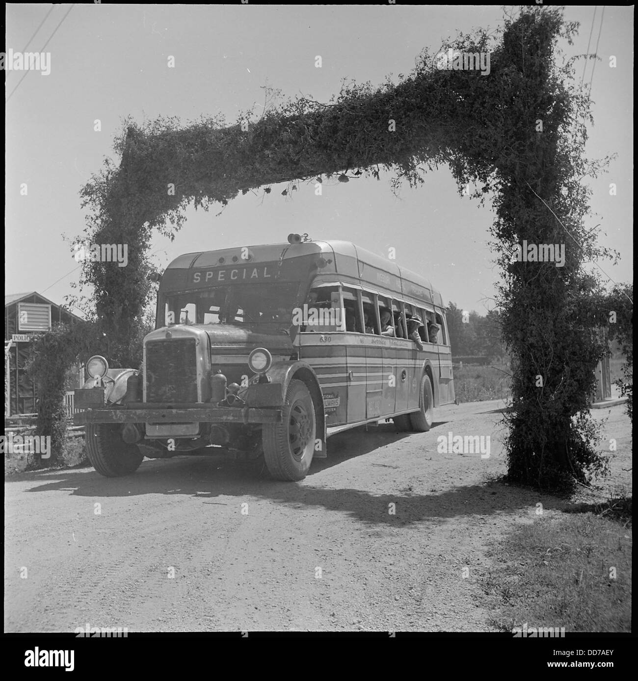A photograph showing a bus load of residents departing the Jerome ...