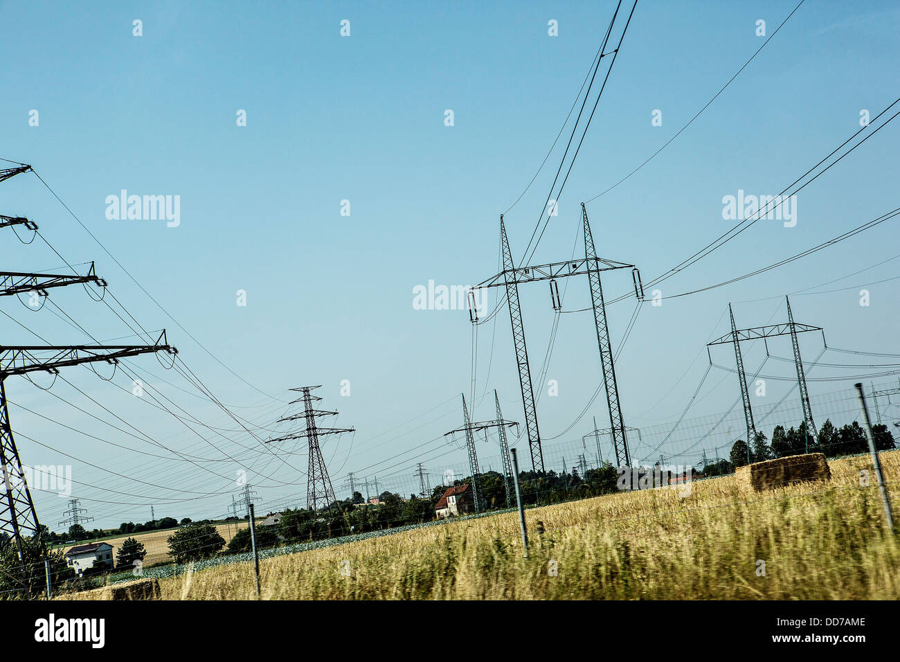 High Voltage pylons, electricity division, distribution Stock Photo - Alamy